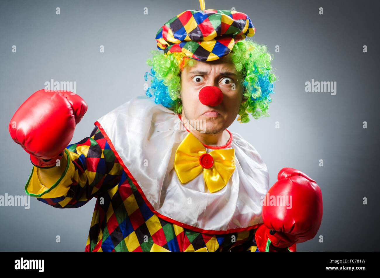 Funny clown in comical concept Stock Photo - Alamy