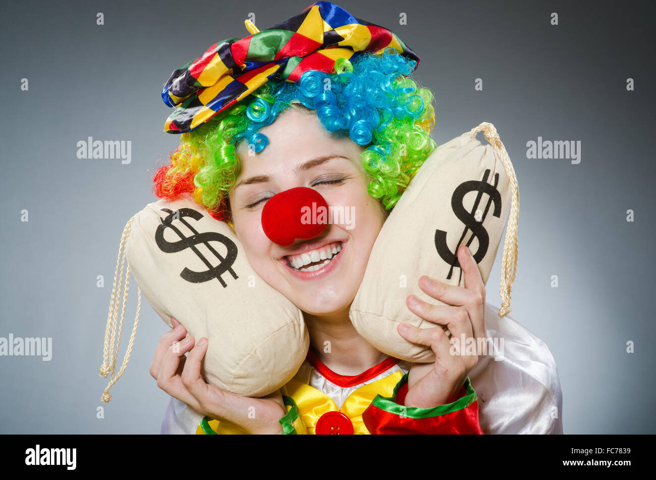 Funny clown in comical concept Stock Photo - Alamy