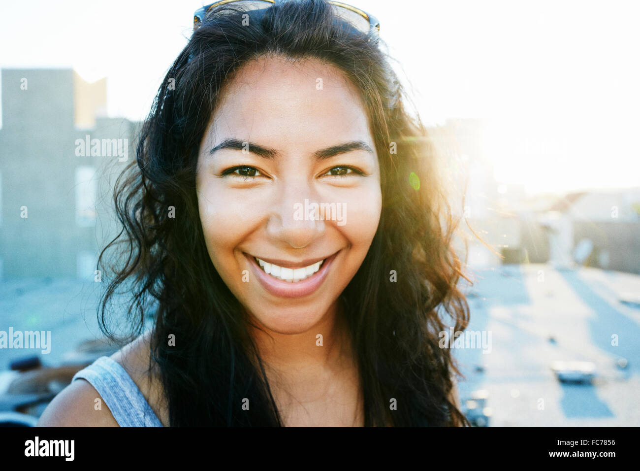 Hispanic woman smiling outdoors Stock Photo - Alamy