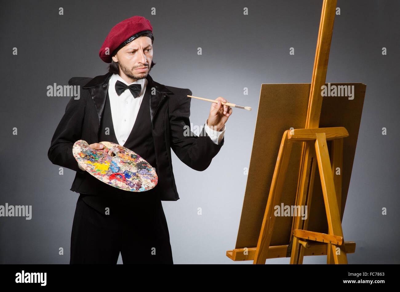 Funny artist working in the studio Stock Photo - Alamy