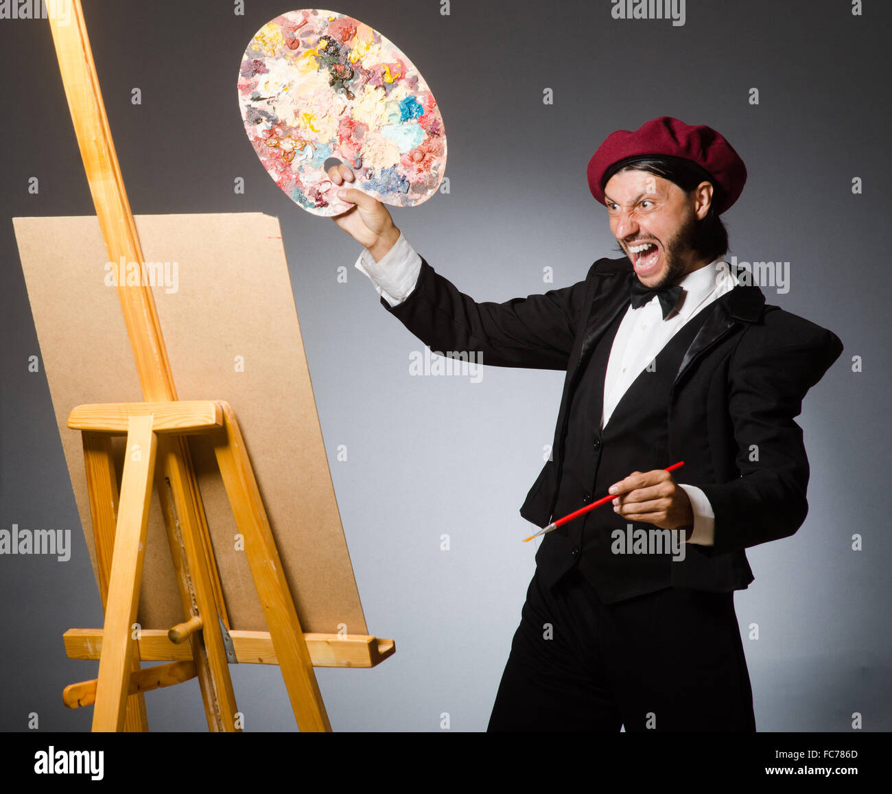 Funny artist working in the studio Stock Photo - Alamy