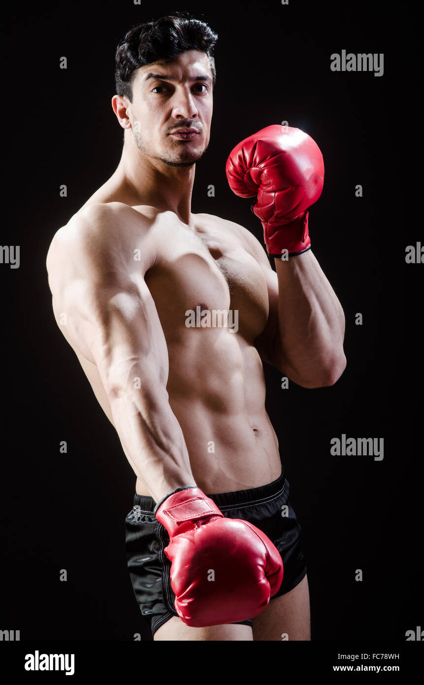 Muscular man in boxing concept Stock Photo - Alamy