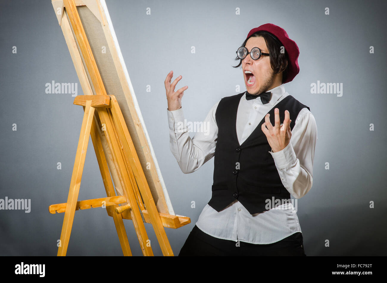 Funny artist in dark studio Stock Photo - Alamy