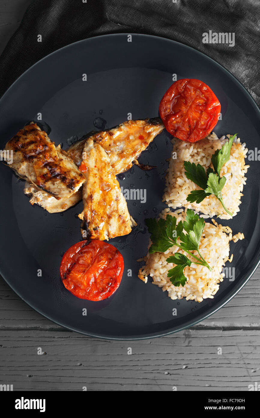 Grilled fish with rice above view Stock Photo - Alamy