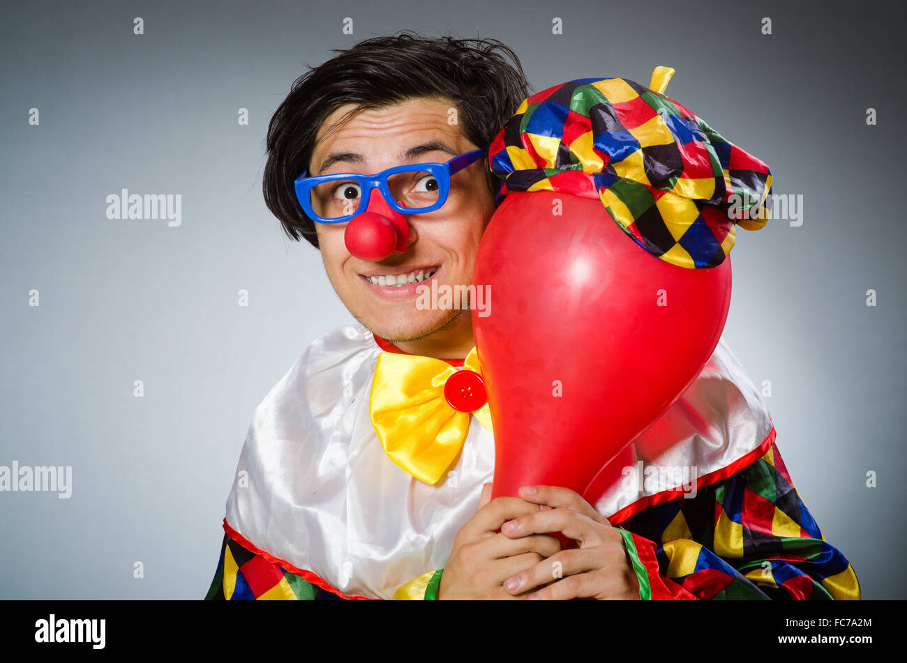 Funny clown in comical concept Stock Photo - Alamy