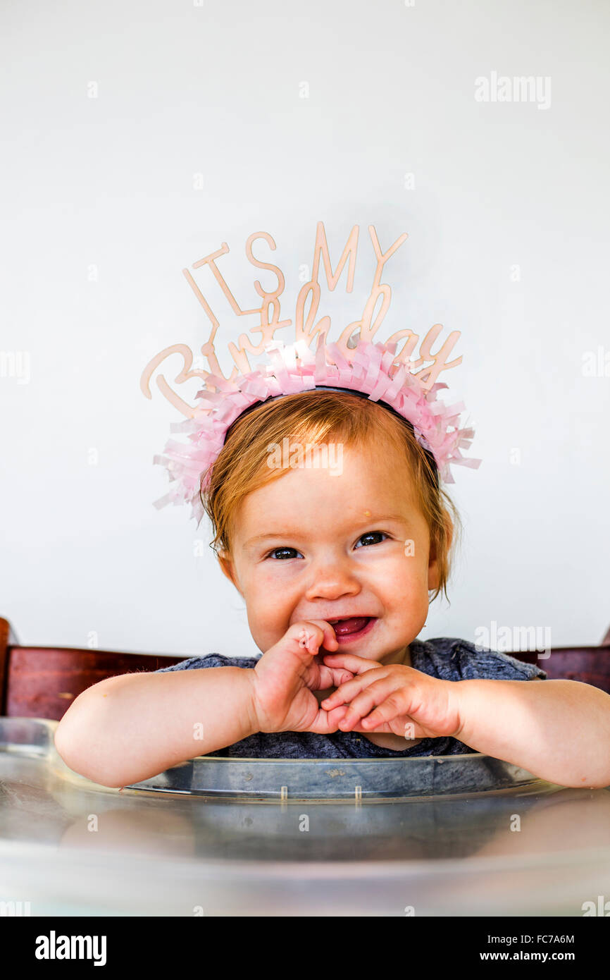 Caucasian baby girl wearing birthday crown Stock Photo - Alamy