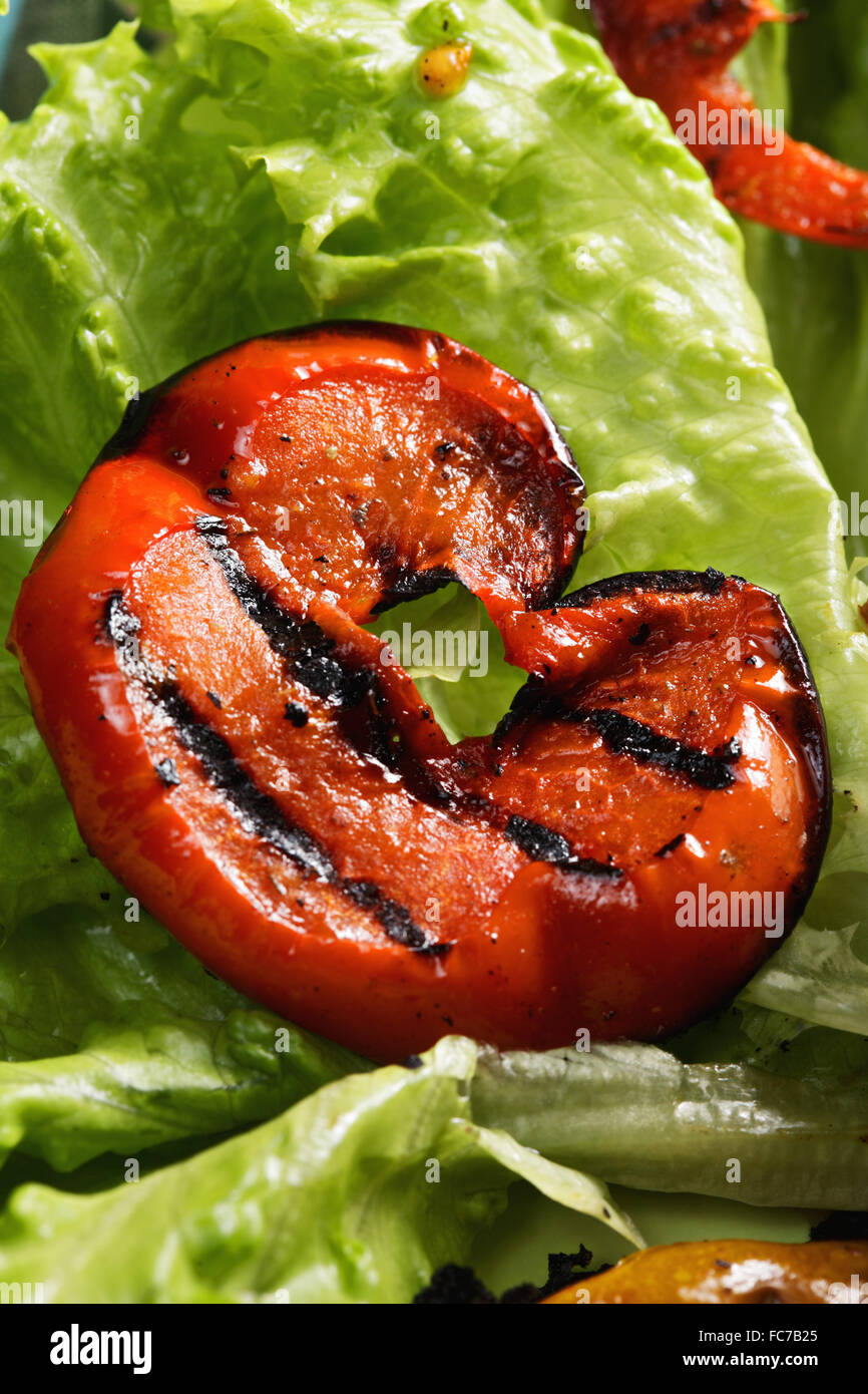 Tomato slice and lettuce Stock Photo - Alamy