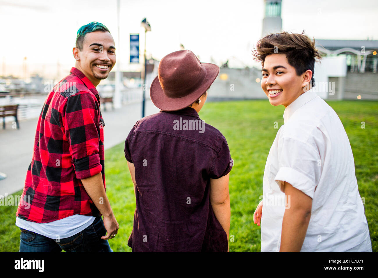 Friends walking outdoors Stock Photo - Alamy