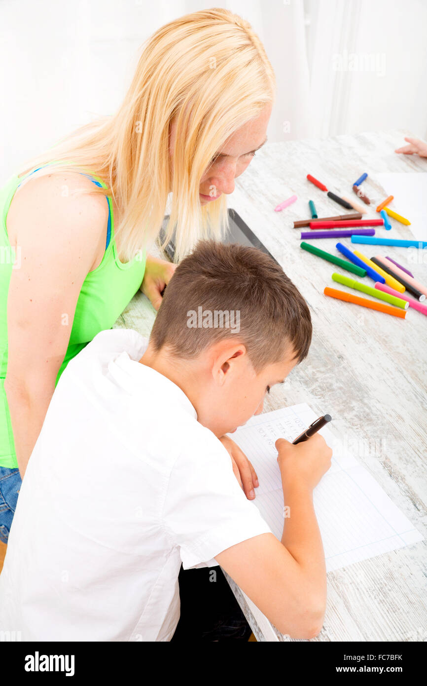 Mother and son doing homework Stock Photo - Alamy