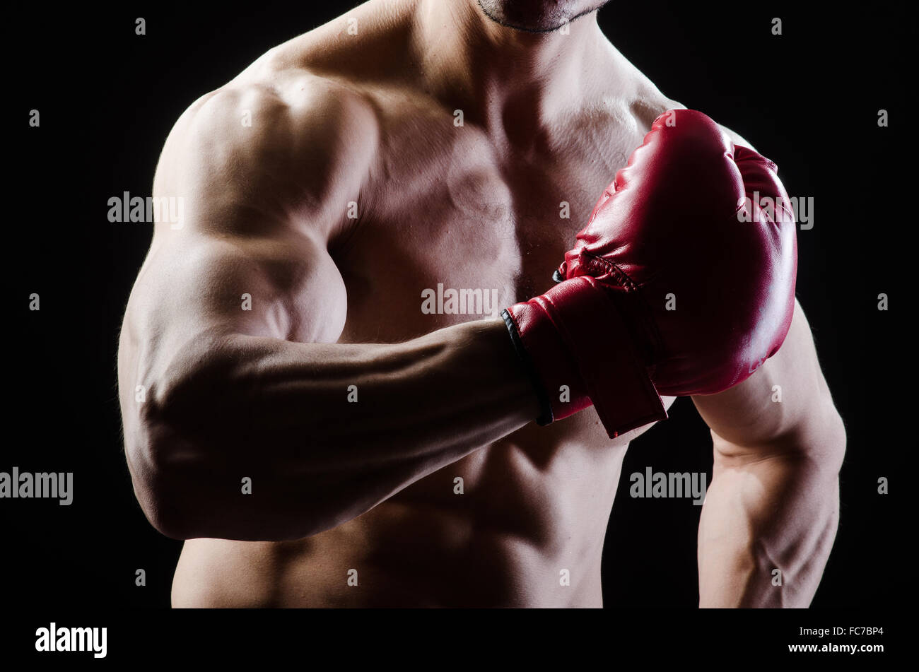 Muscular man in boxing concept Stock Photo - Alamy