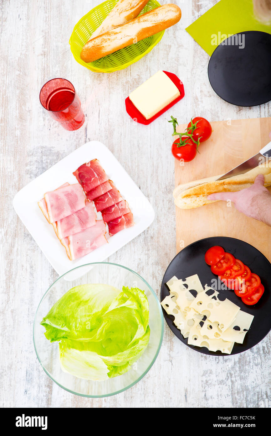 Young man preparing a Sandwich Stock Photo - Alamy