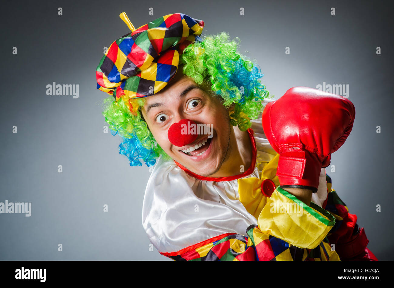 Funny clown in comical concept Stock Photo - Alamy