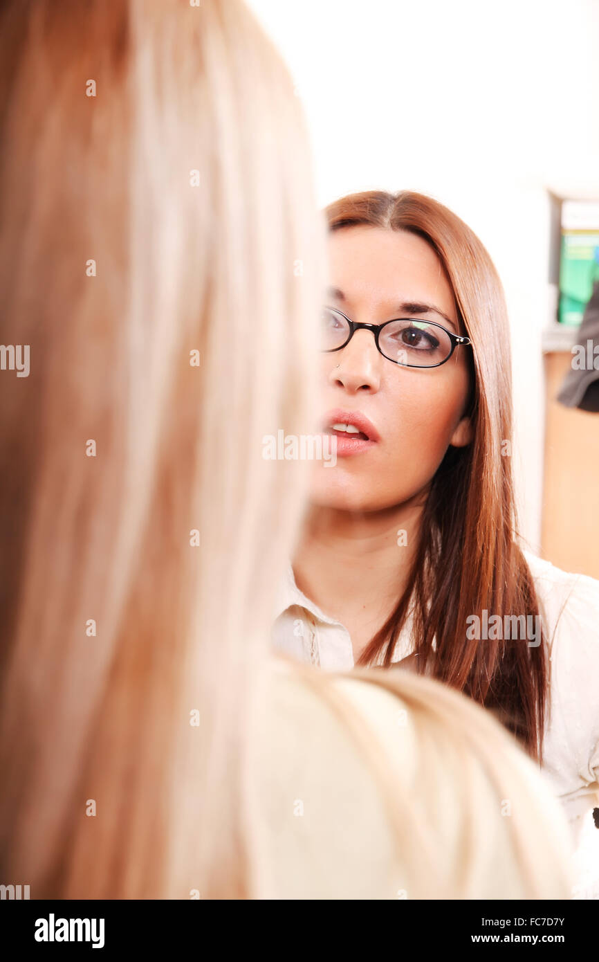 Two ladies talk Stock Photo - Alamy