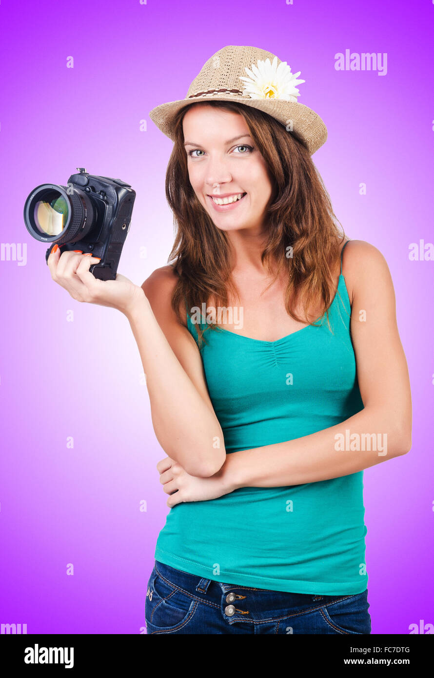 Attractive female photographer on white Stock Photo - Alamy