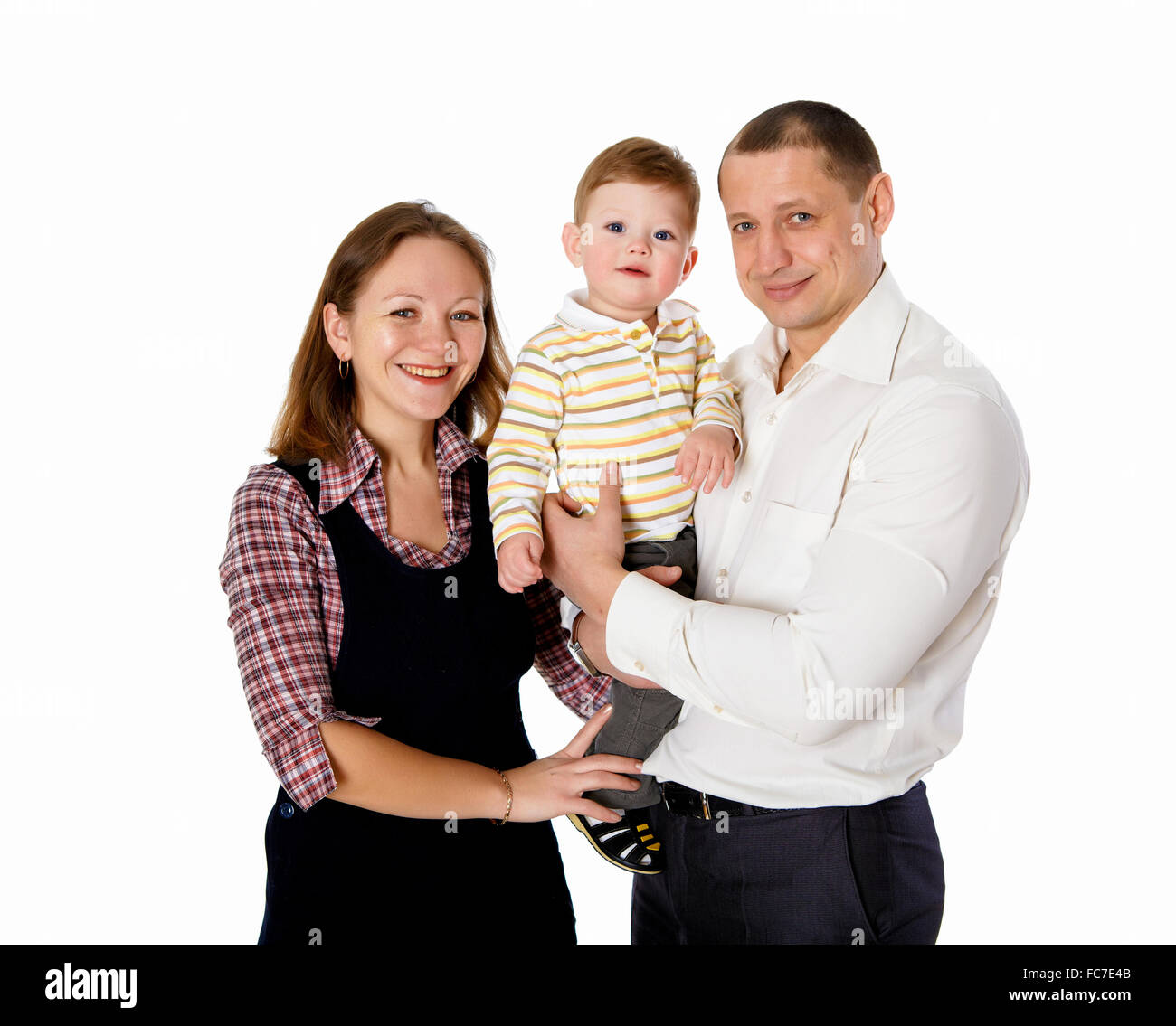 portrait of mother, father and their child together in studio Stock ...