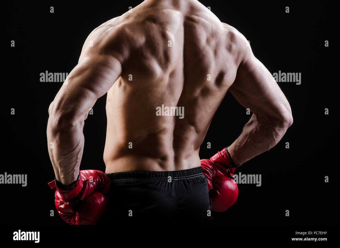 Muscular man in boxing concept Stock Photo - Alamy