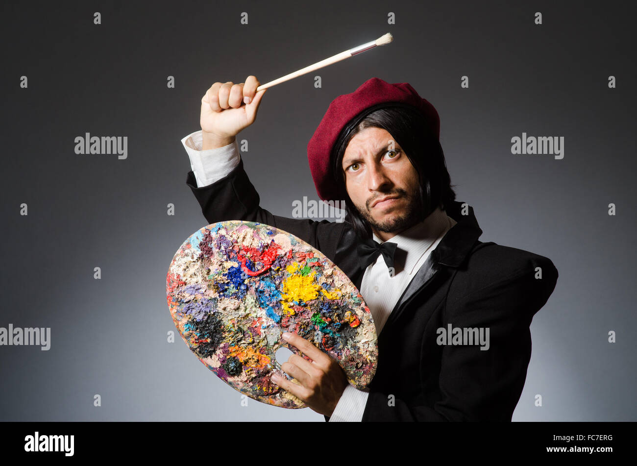 Funny artist working in the studio Stock Photo - Alamy