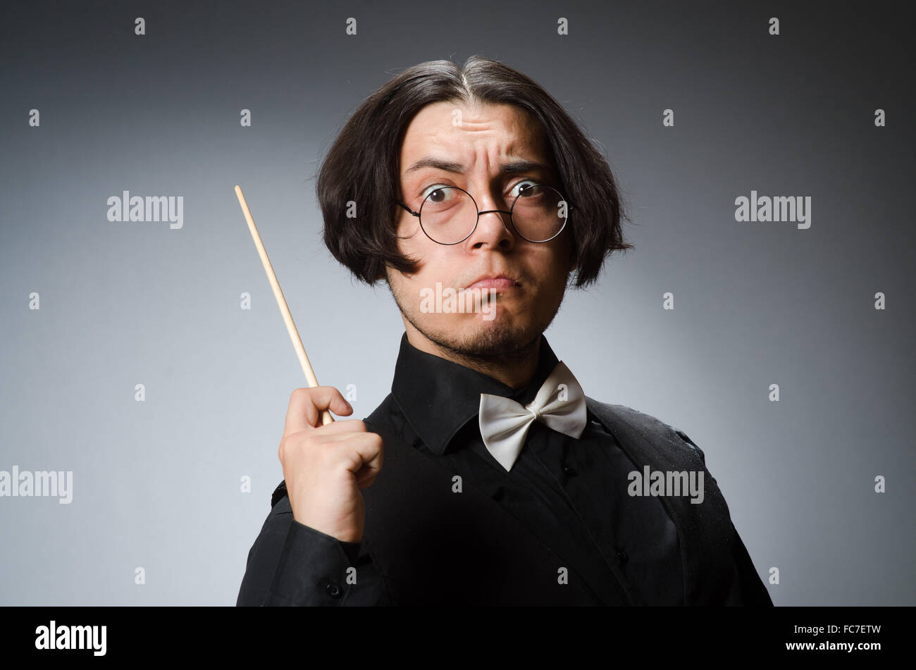Funny conductor in musical concept Stock Photo - Alamy