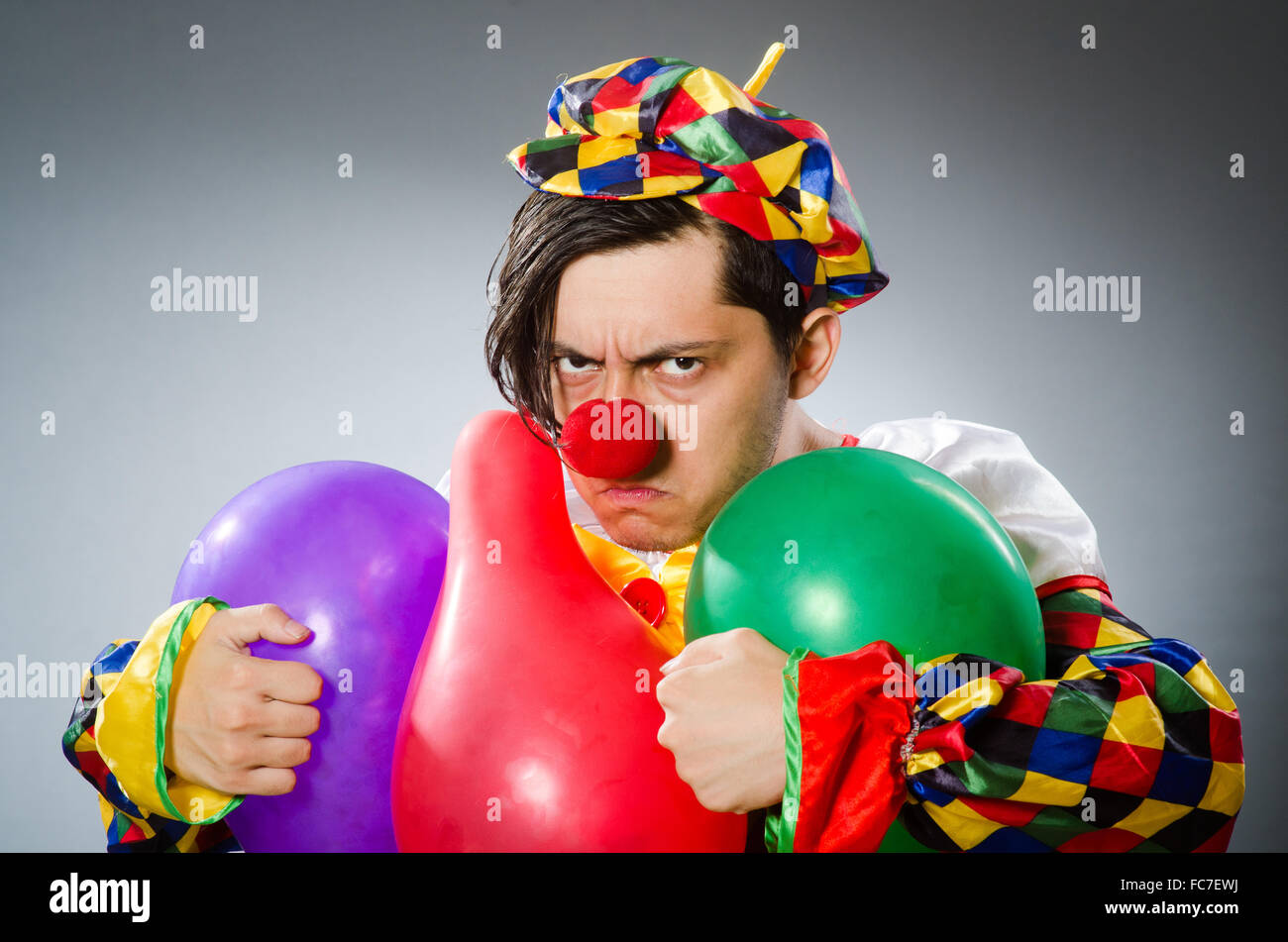 Funny clown in comical concept Stock Photo - Alamy
