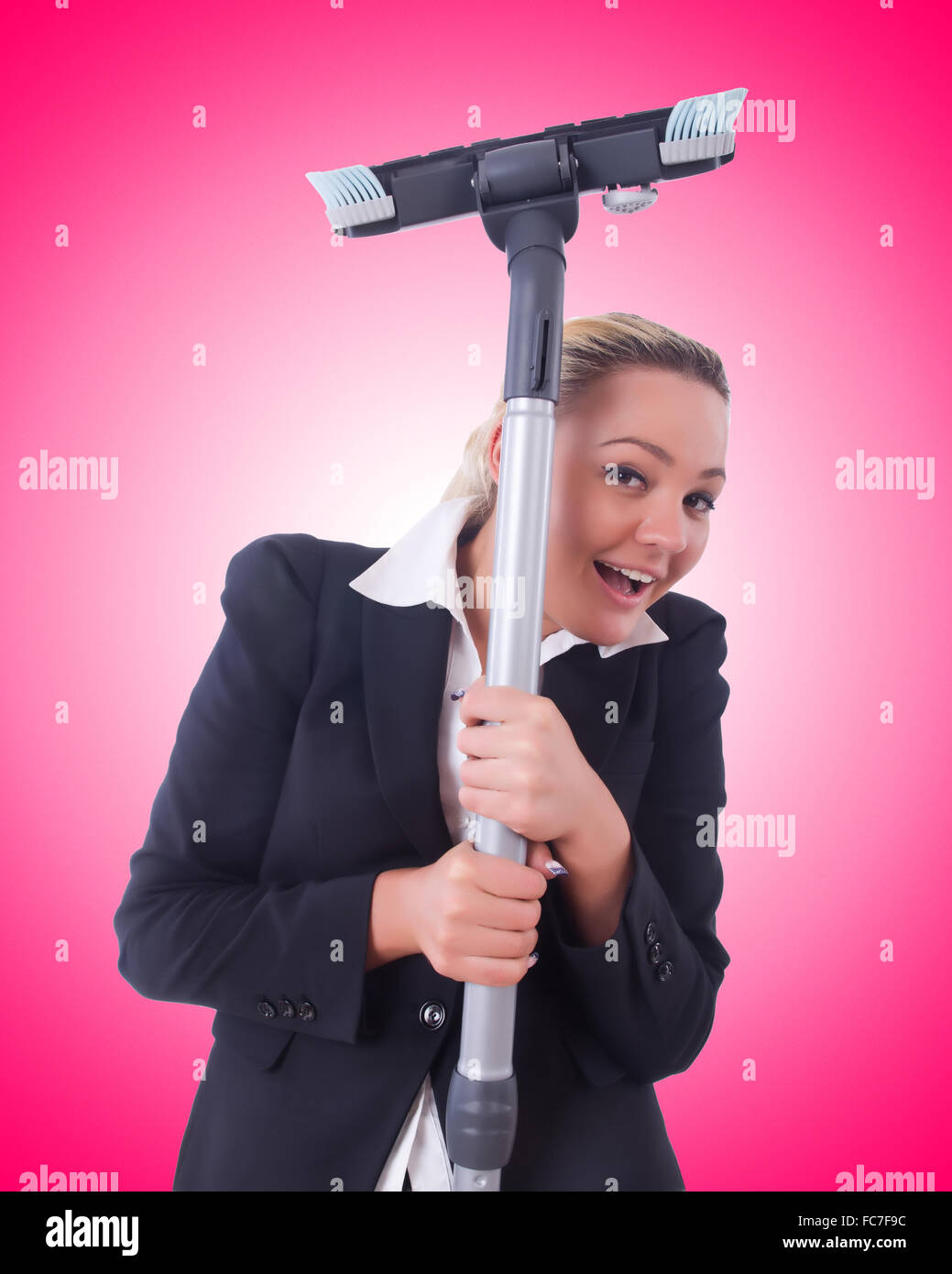 Businesswoman with vacuum cleaner on white Stock Photo - Alamy