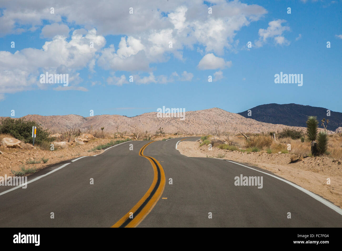 Empty road in rural desert landscape Stock Photo - Alamy