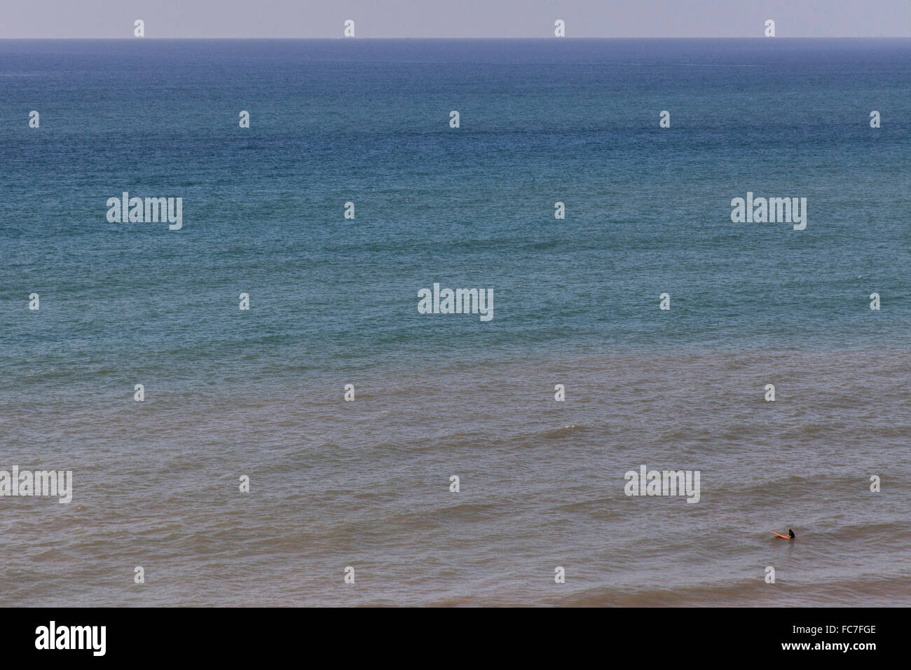 Aerial view of surfer floating on ocean waves Stock Photo - Alamy