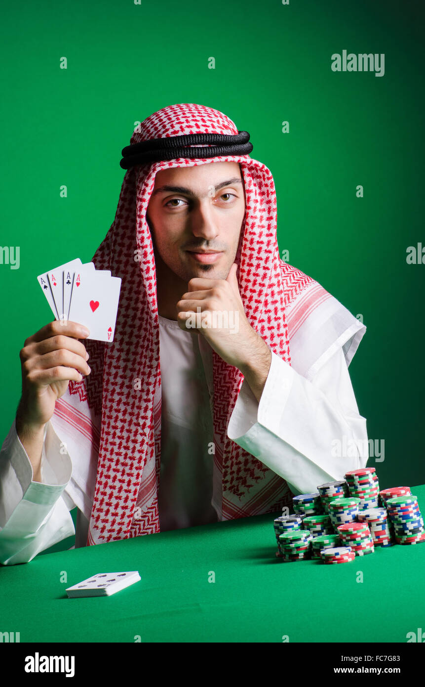 Arab man playing in the casino Stock Photo - Alamy