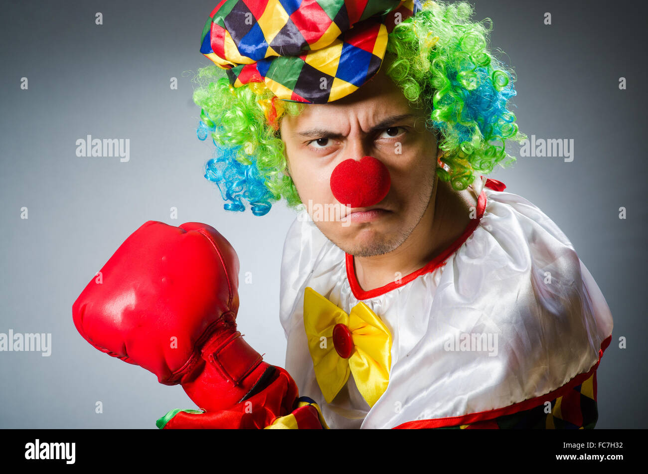 Funny clown in comical concept Stock Photo - Alamy