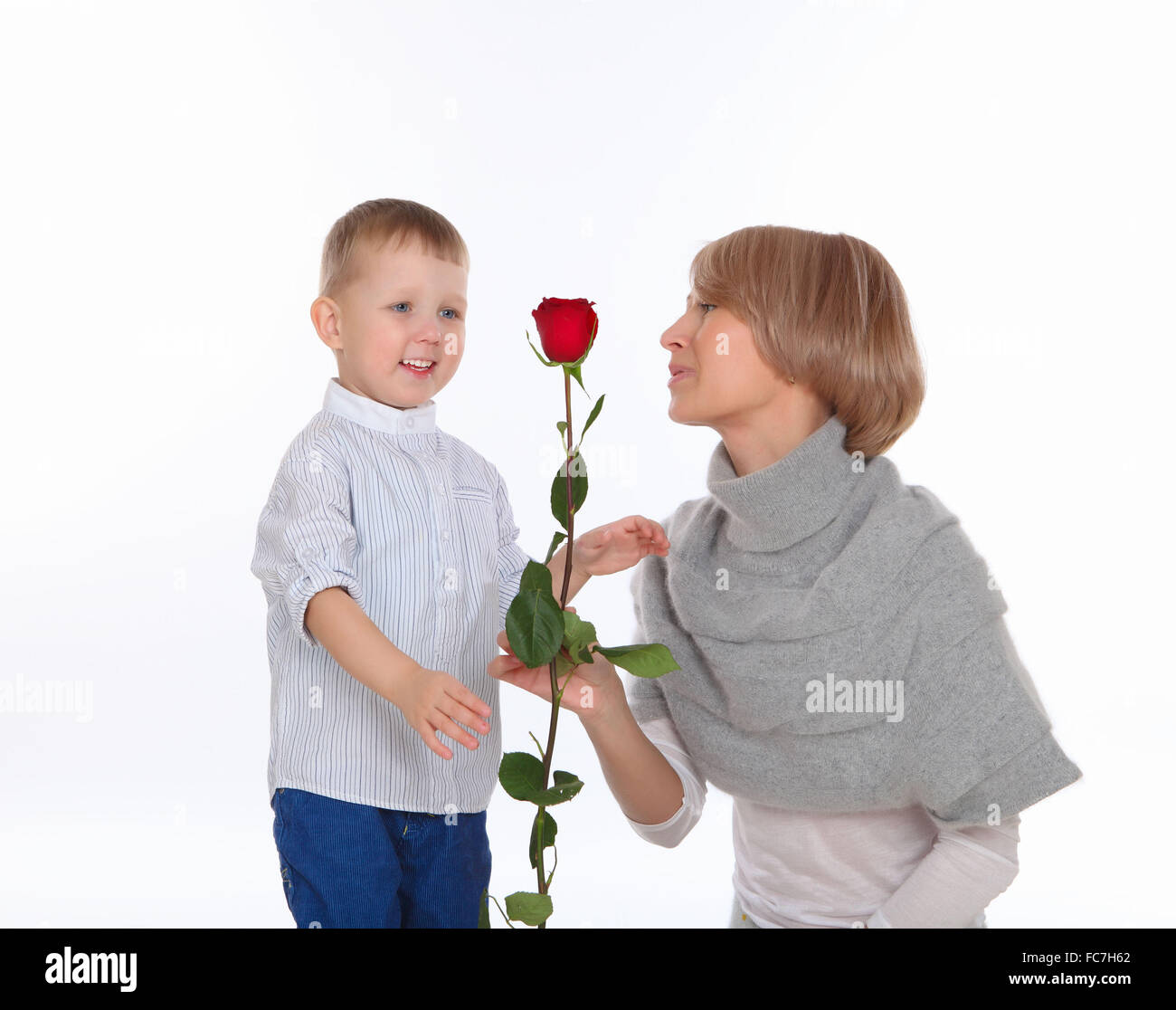 Happy little boy give rose to mom hi-res stock photography and images ...