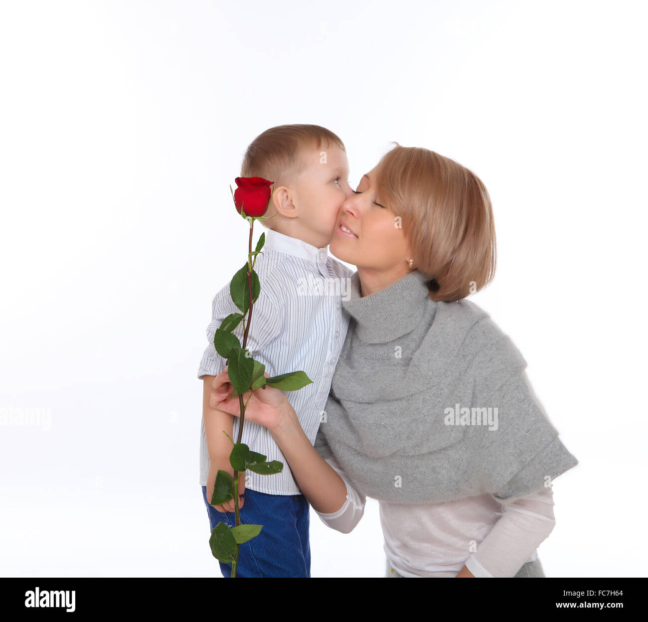 Happy little boy give rose to mom hi-res stock photography and images ...