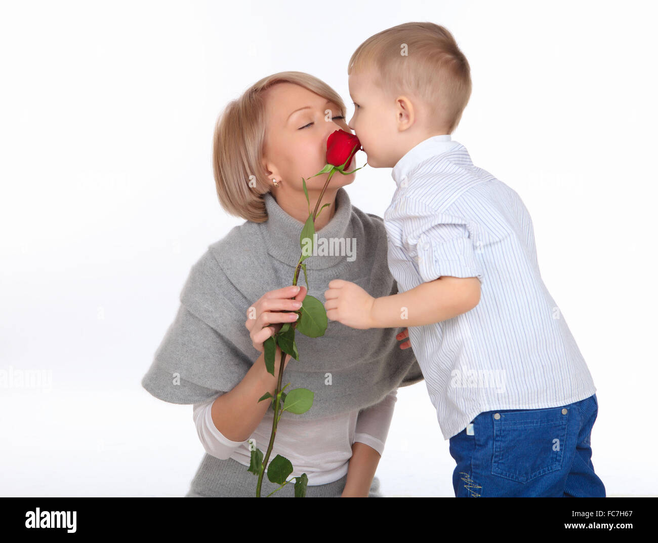 Happy little boy give rose to mom hi-res stock photography and images ...