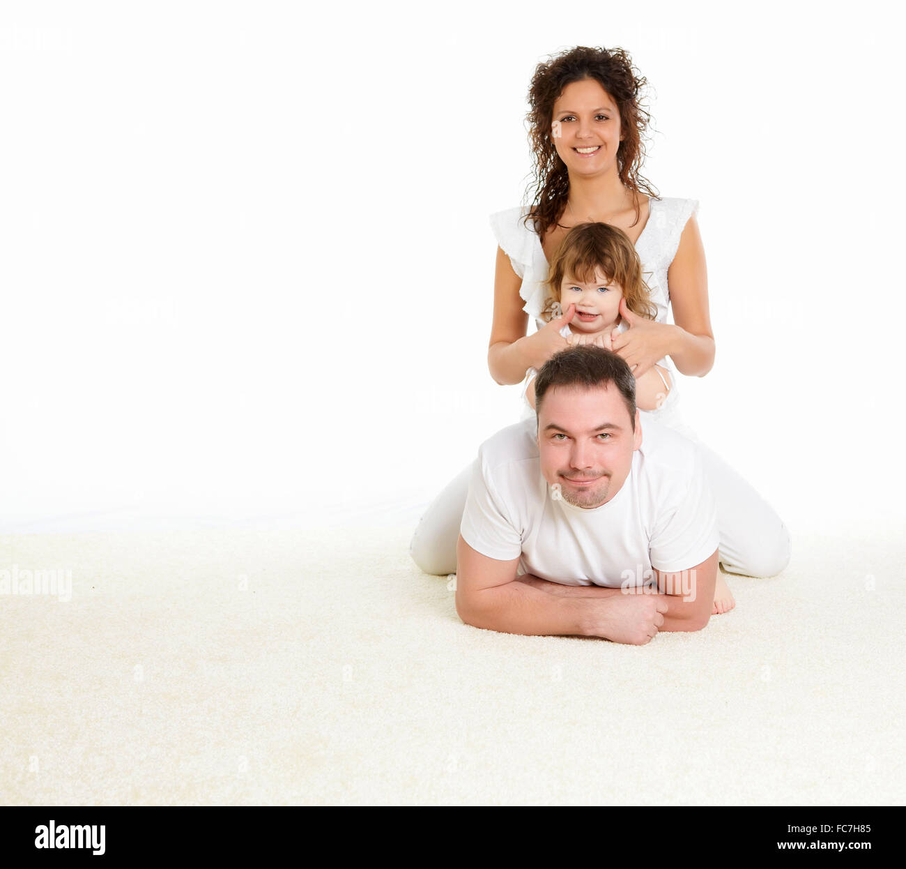 portrait of mother, father and their child together in studio Stock ...