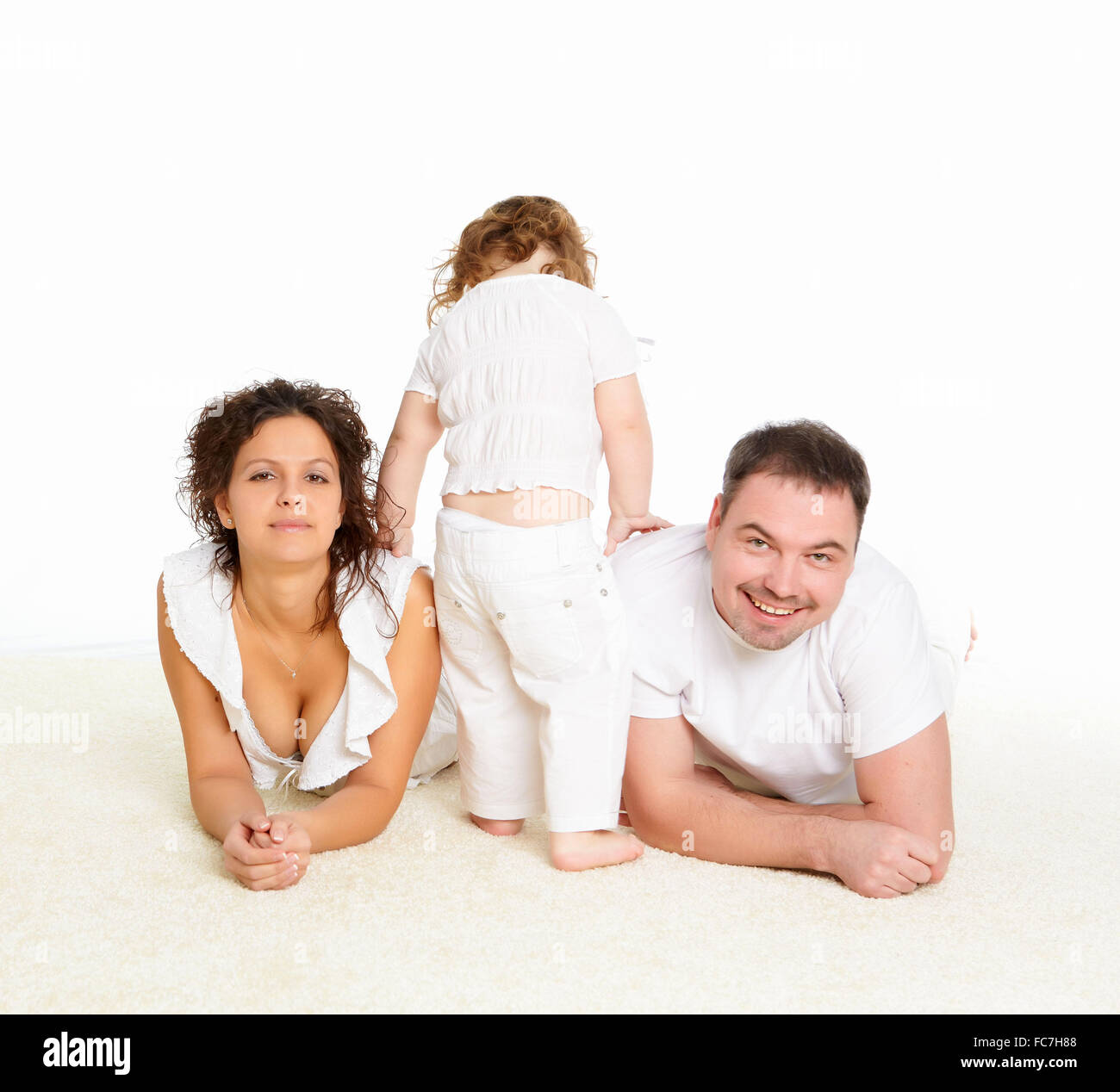 portrait of mother, father and their child together in studio Stock ...