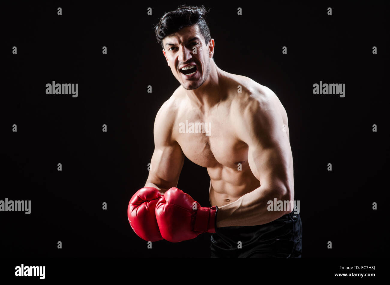 Muscular man in boxing concept Stock Photo - Alamy