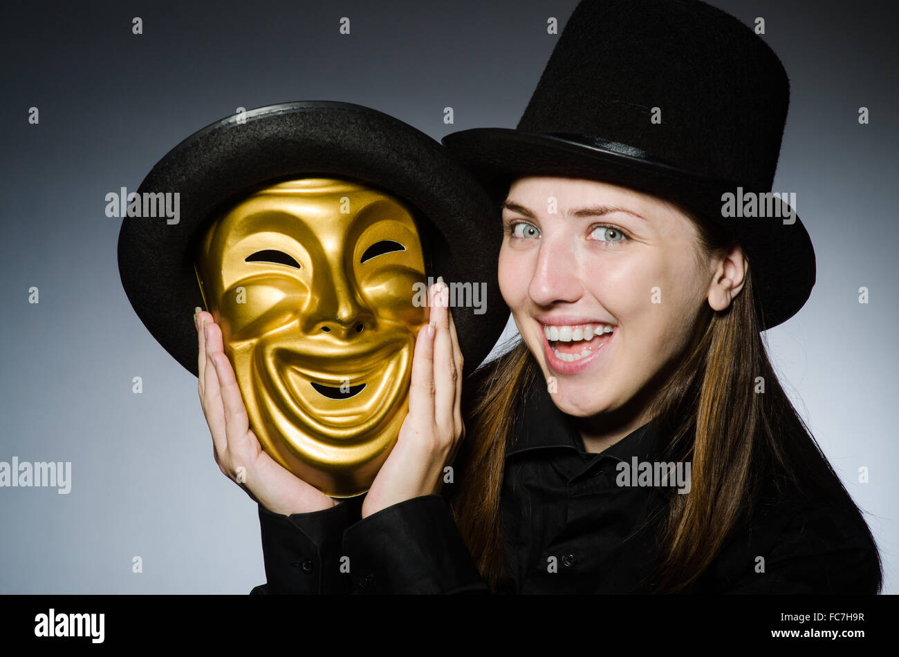Woman with mask in funny concept Stock Photo - Alamy