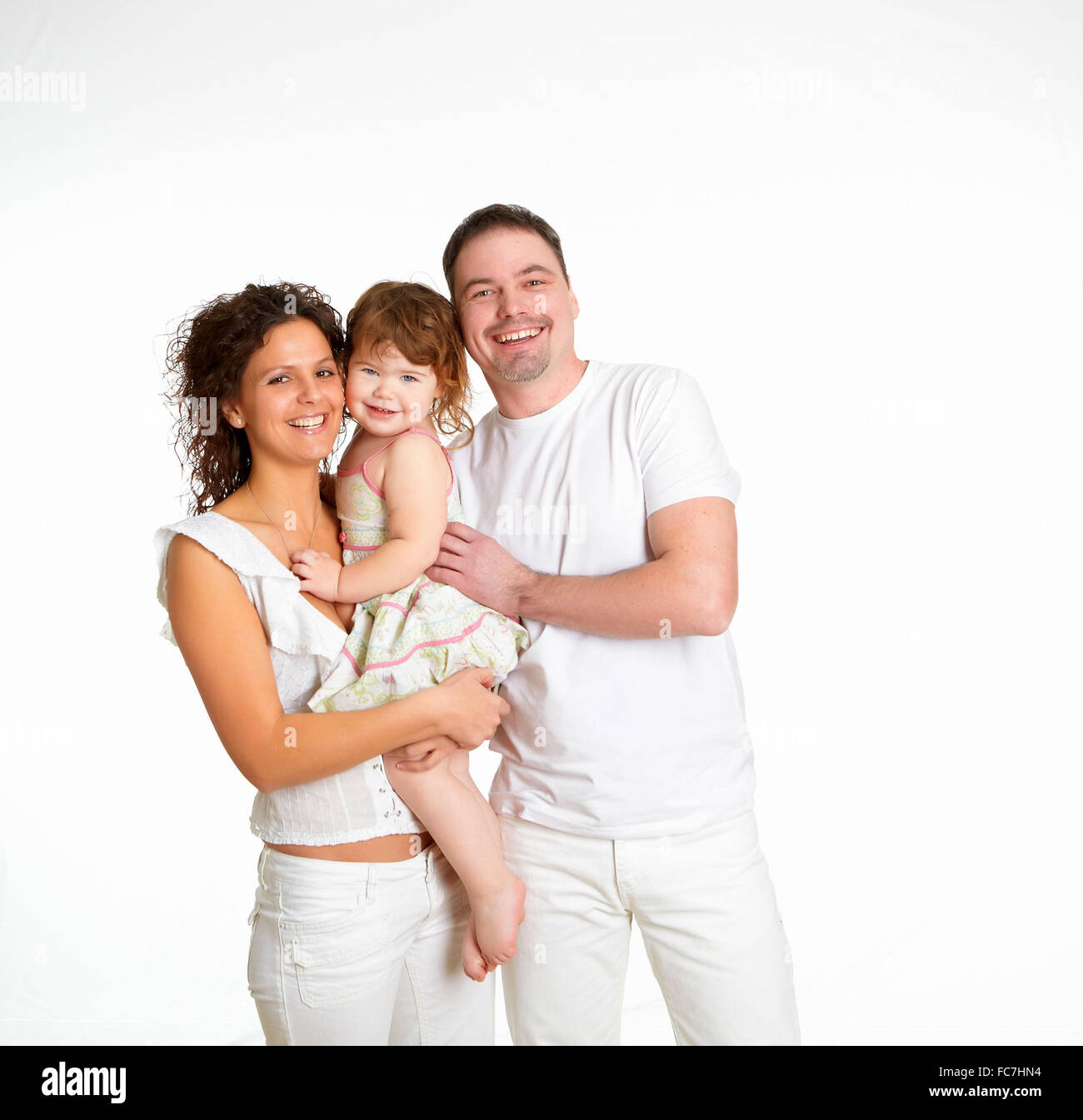 portrait of mother, father and their child together in studio Stock ...