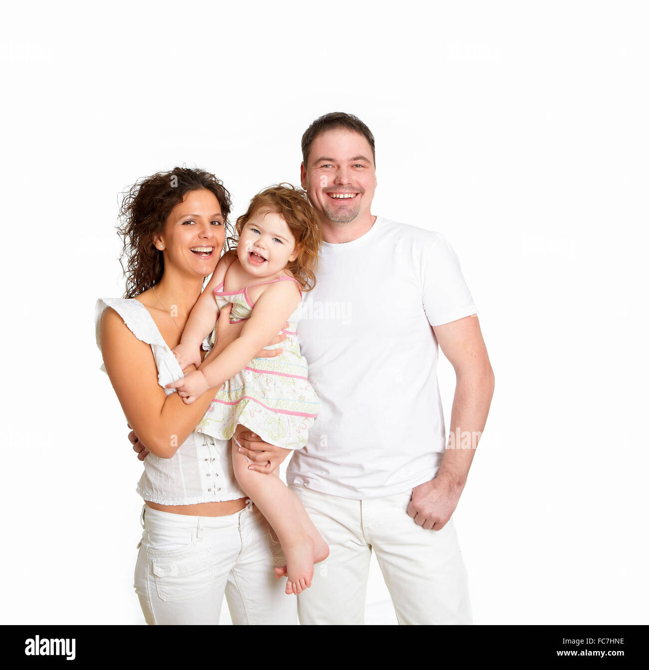 portrait of mother, father and their child together in studio Stock ...