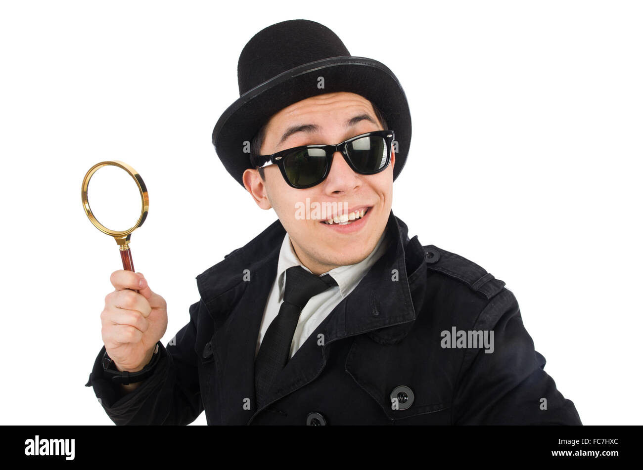 Young detective in black coat holding magnifying glass isolated Stock ...