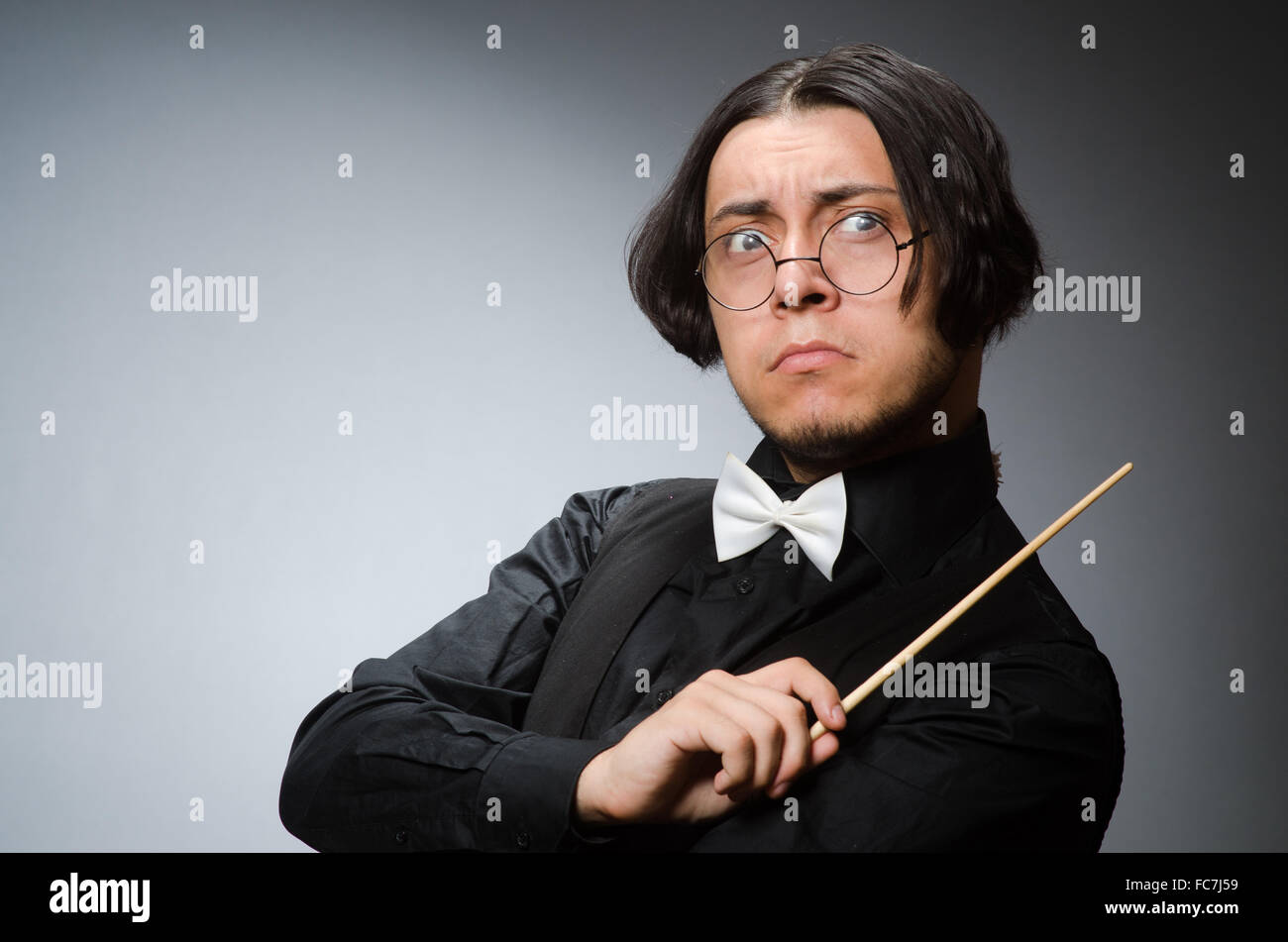 Funny conductor in musical concept Stock Photo - Alamy