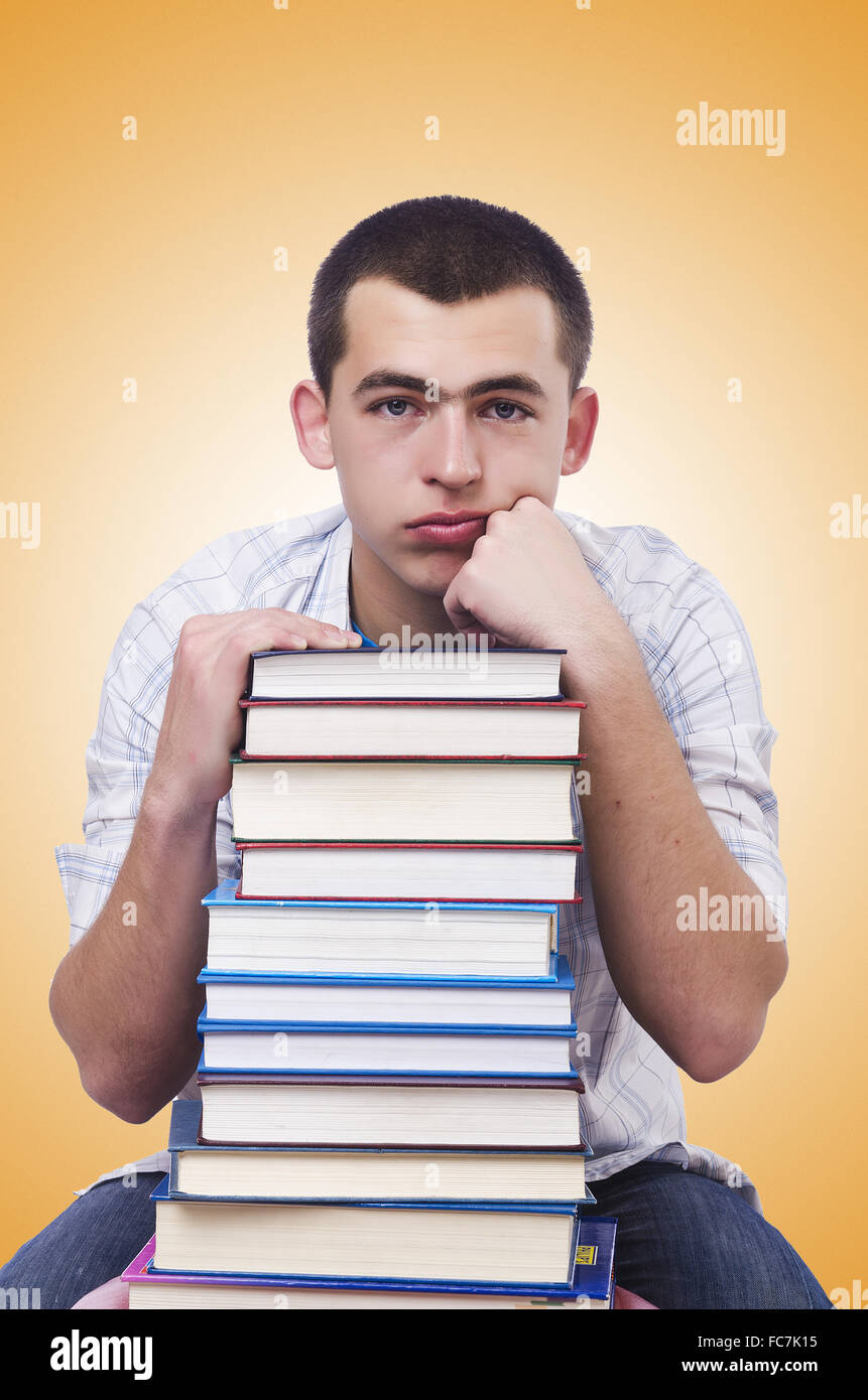 Student with lots of books on white Stock Photo - Alamy