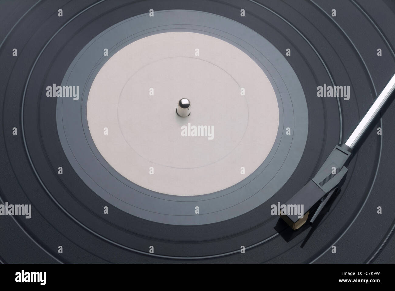 Vinyl record with tone arm and label with copy space Stock Photo - Alamy