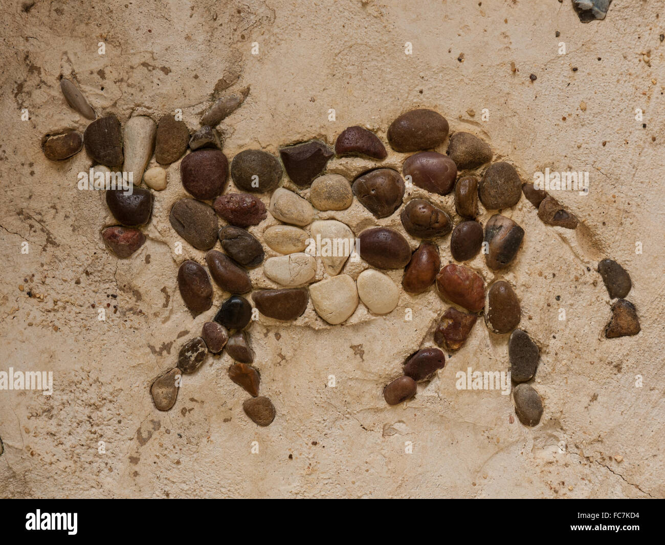 Ornate mosaic pebble design of a bull or cow Stock Photo - Alamy