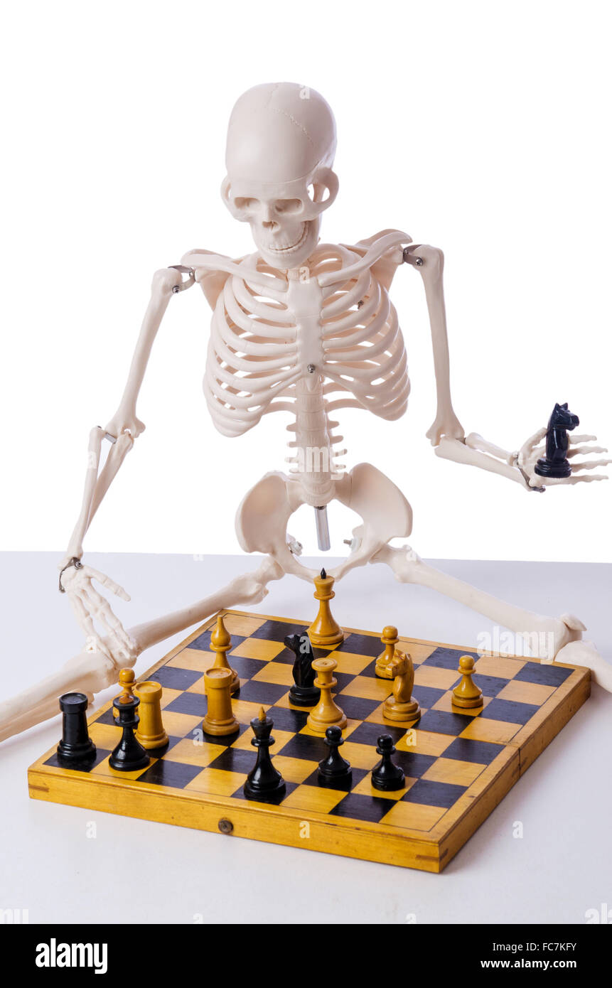 Skeleton playing chess game on white Stock Photo - Alamy