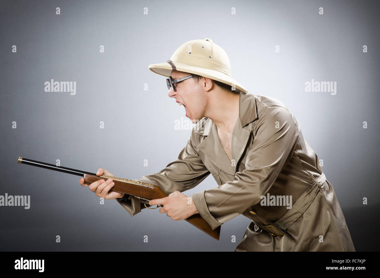 Funny hunter in hunting concept Stock Photo - Alamy