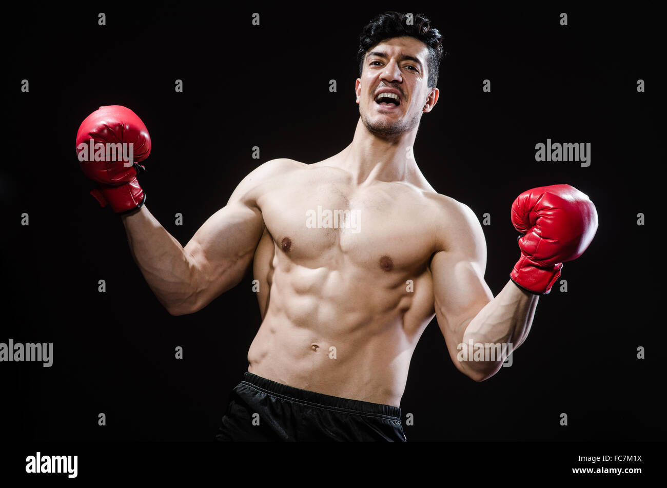 Muscular man in boxing concept Stock Photo - Alamy