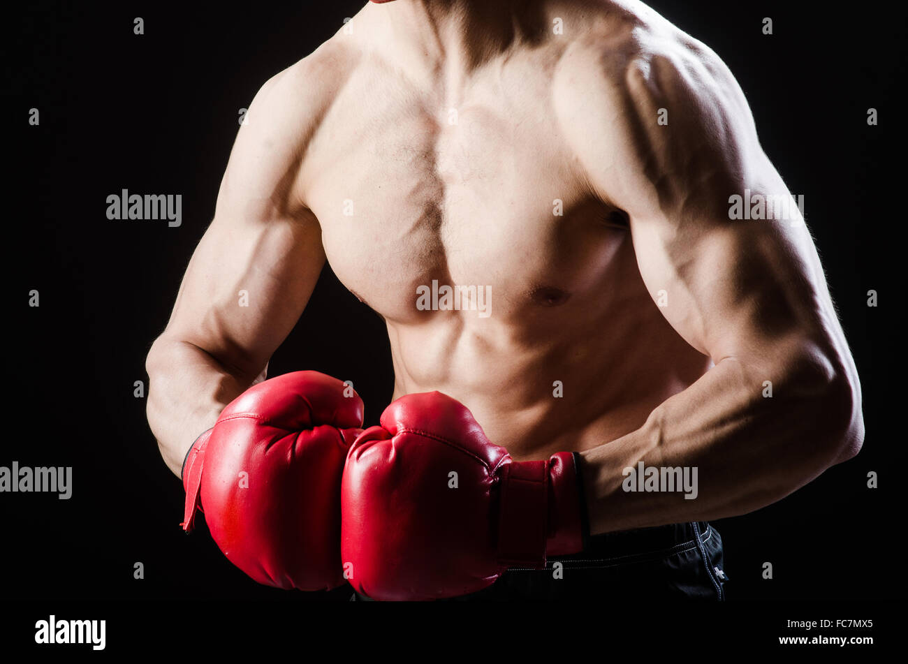 Muscular man in boxing concept Stock Photo - Alamy