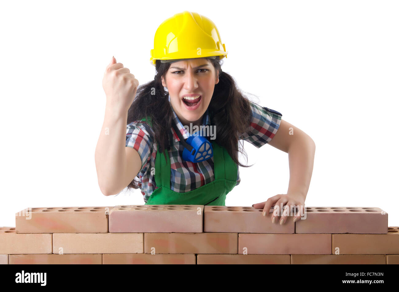 Angry female construction worker on white Stock Photo - Alamy