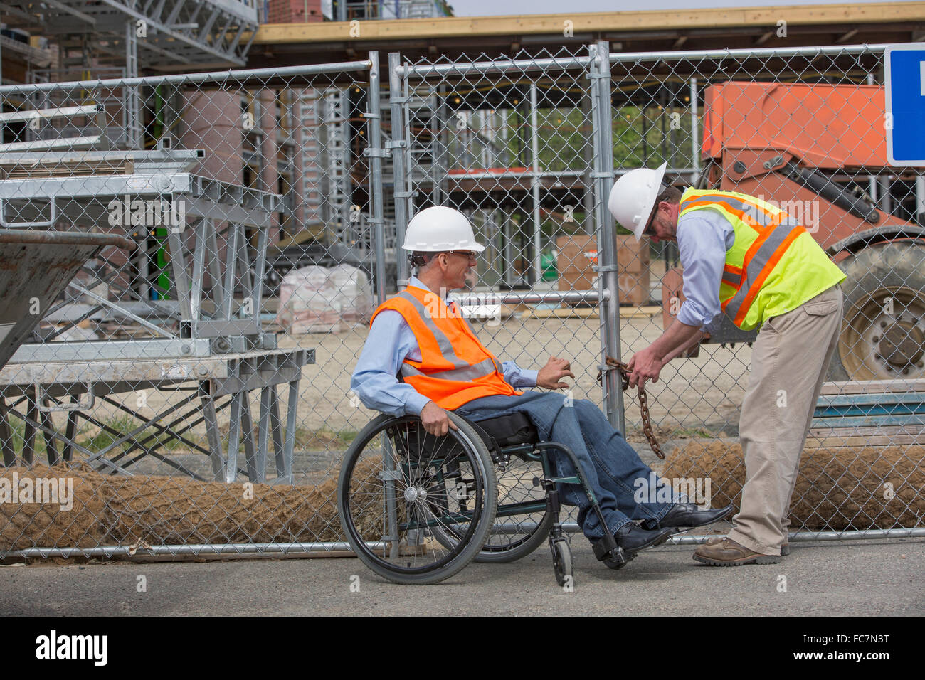 Caucasian engineers working on construction site Stock Photo - Alamy