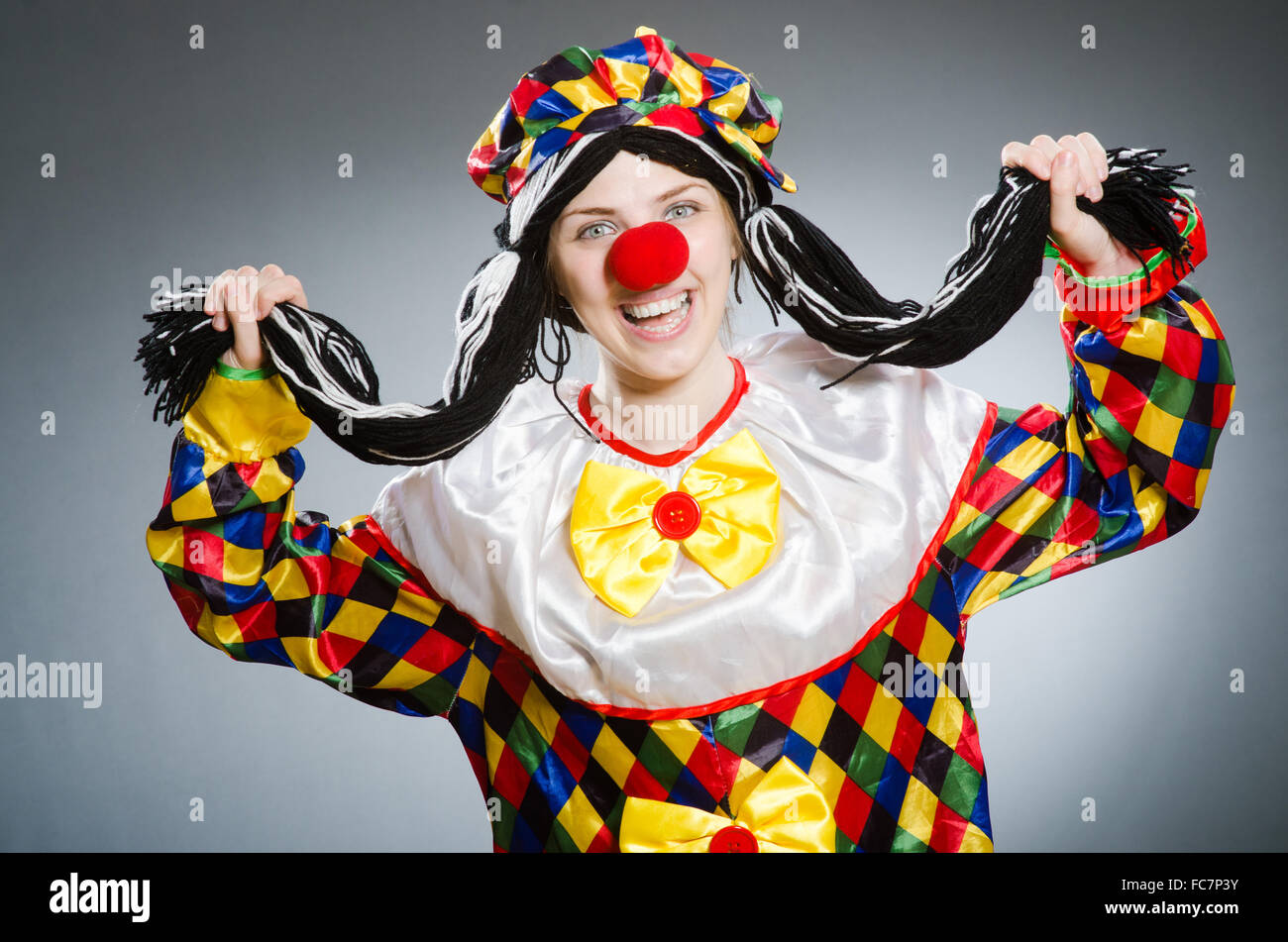 Funny clown in comical concept Stock Photo - Alamy