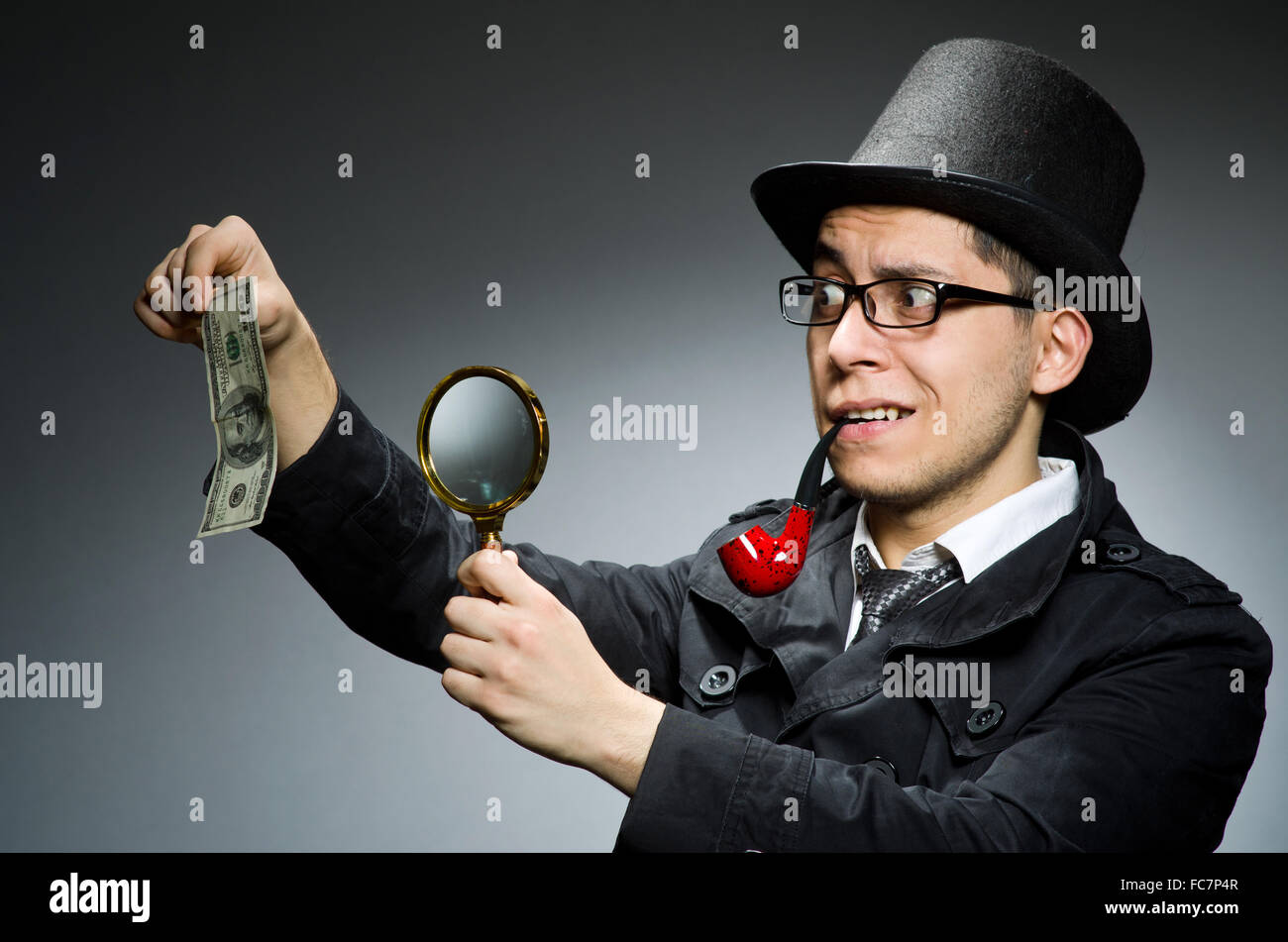 Young detective in black coat with money against gray Stock Photo - Alamy